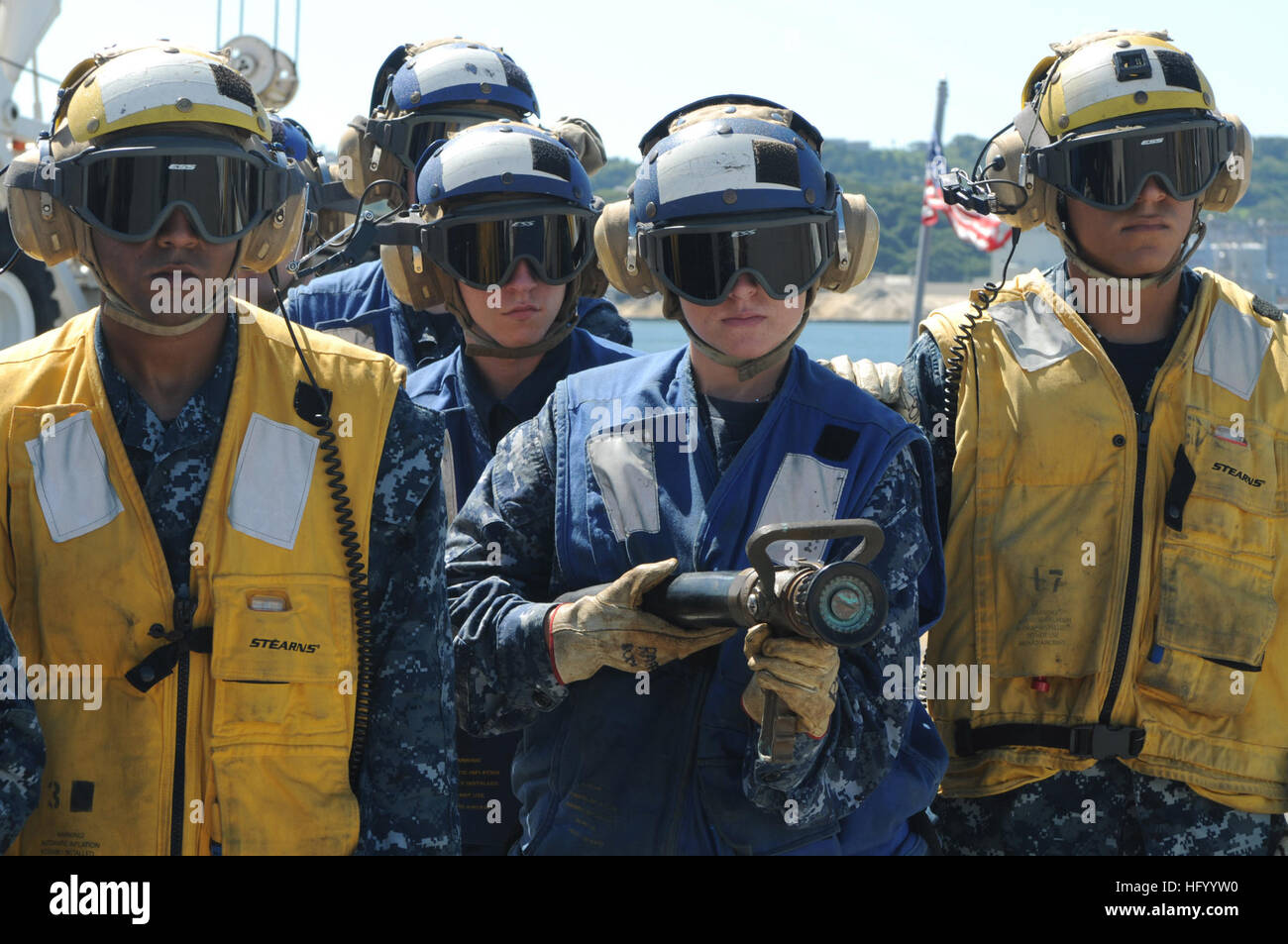 Aviation boatswain's mates conduct a damage control drill to respond to ...