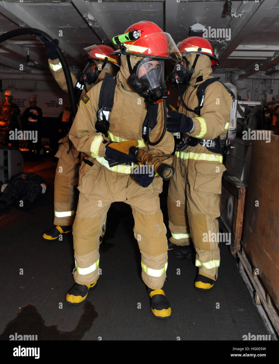 Sailors man fire hose during hi-res stock photography and images - Alamy