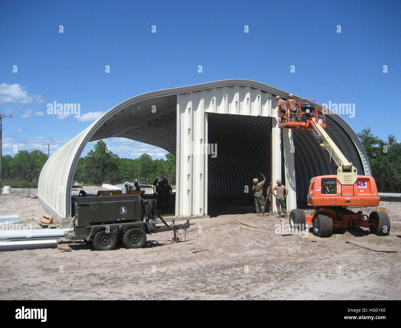 Seabees from Naval Mobile Construction Battalion (NMCB) 11 work on an ...