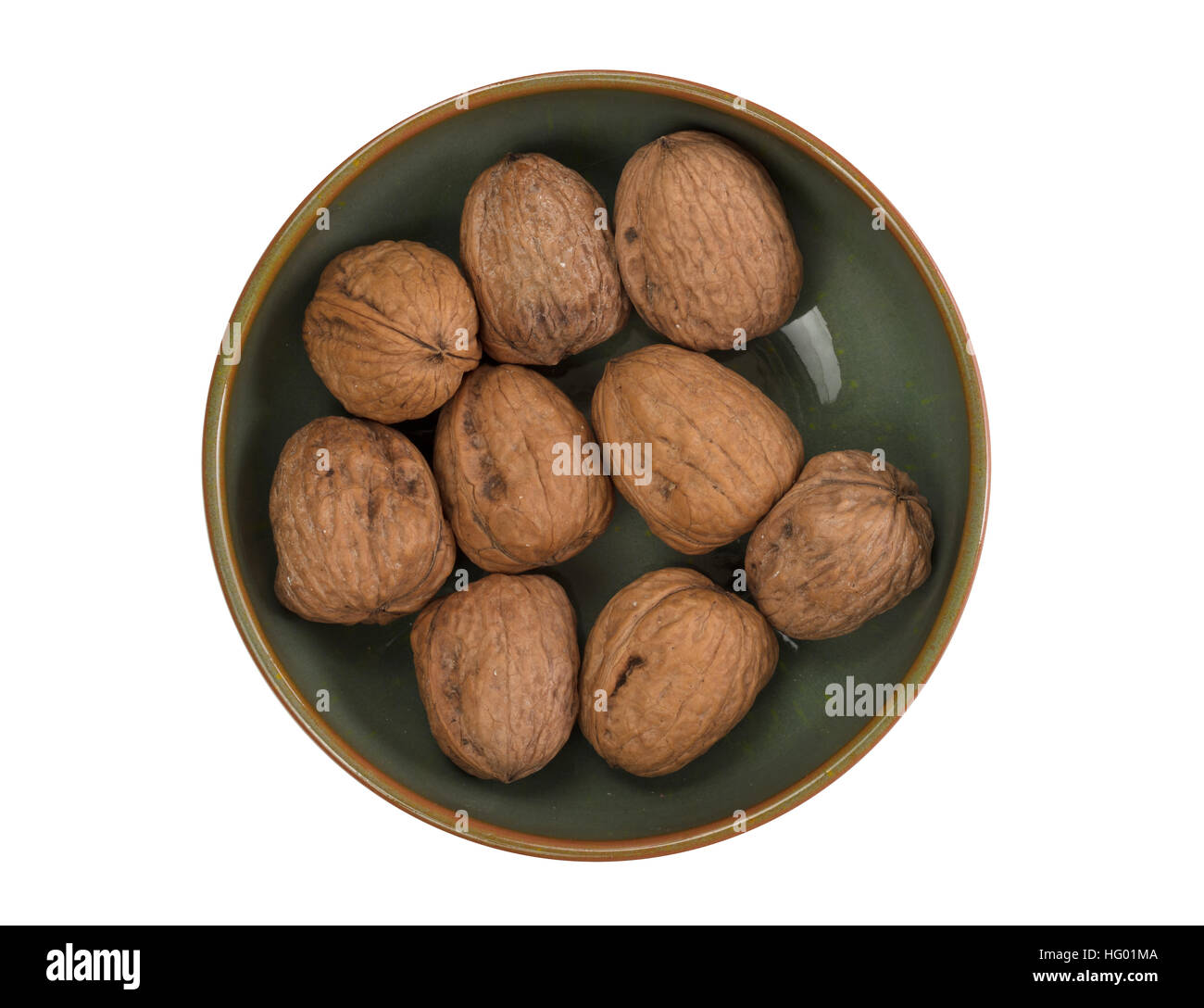 Wallnuts in a bowl, isolated on white Stock Photo - Alamy