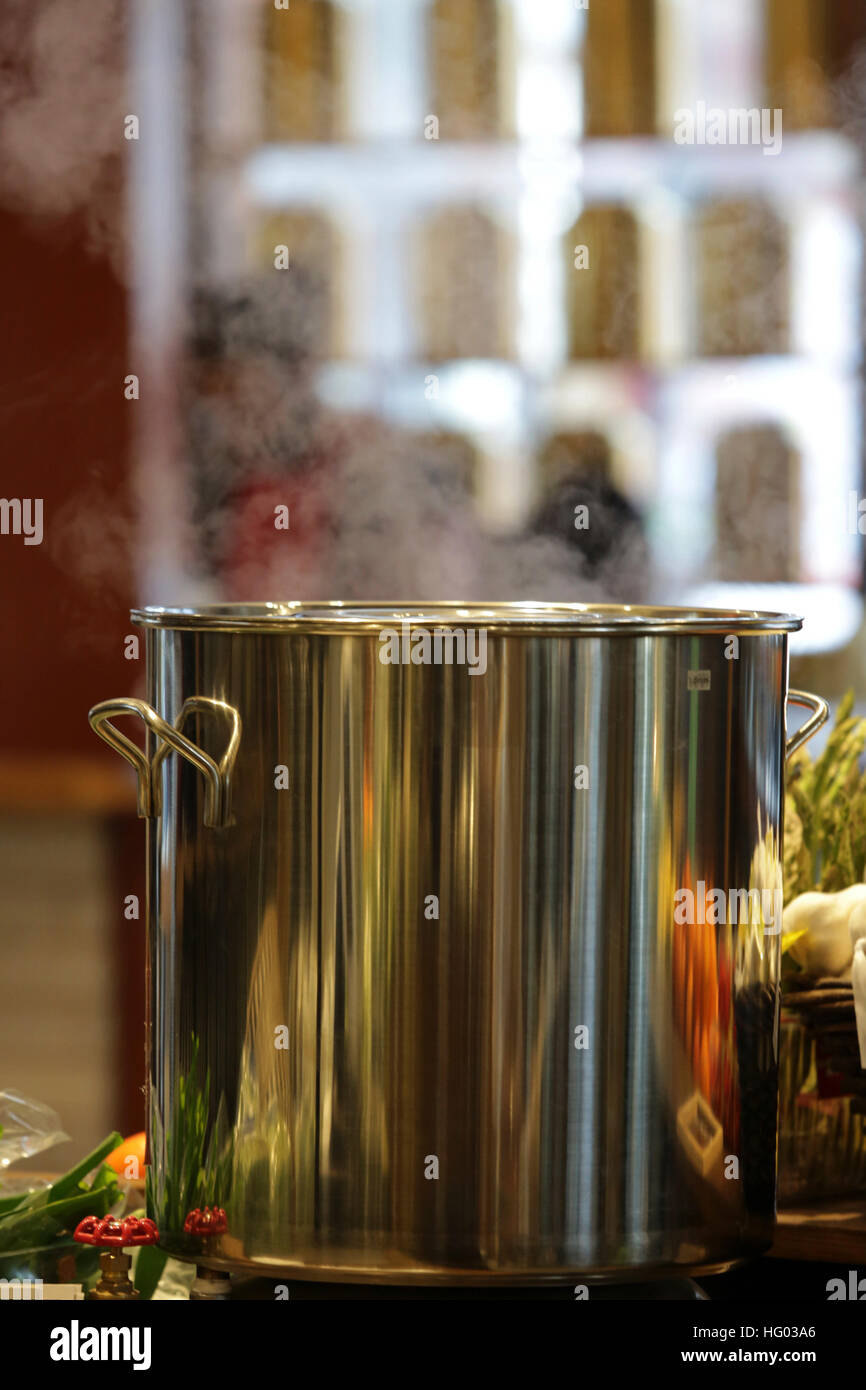 Steaming pot in a modern kitchen Stock Photo - Alamy