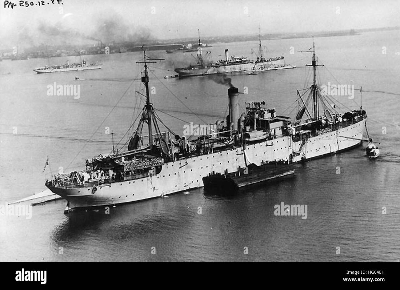 Submarine tender USS Camden (AS-64) moored in port, providing ...