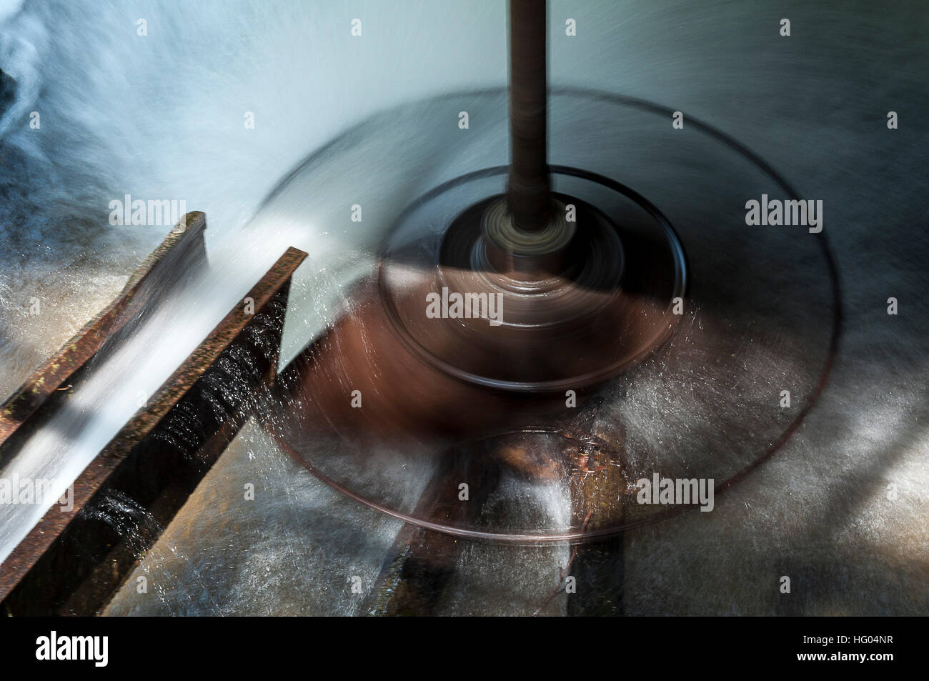 Spinning wheel of a water mill. Horizontal water wheel. Long exposure ...