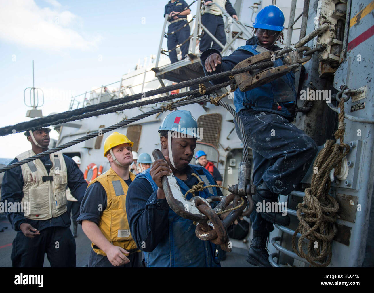 Sailors aboard the guided-missile destroyer USS Stout secure a highline ...