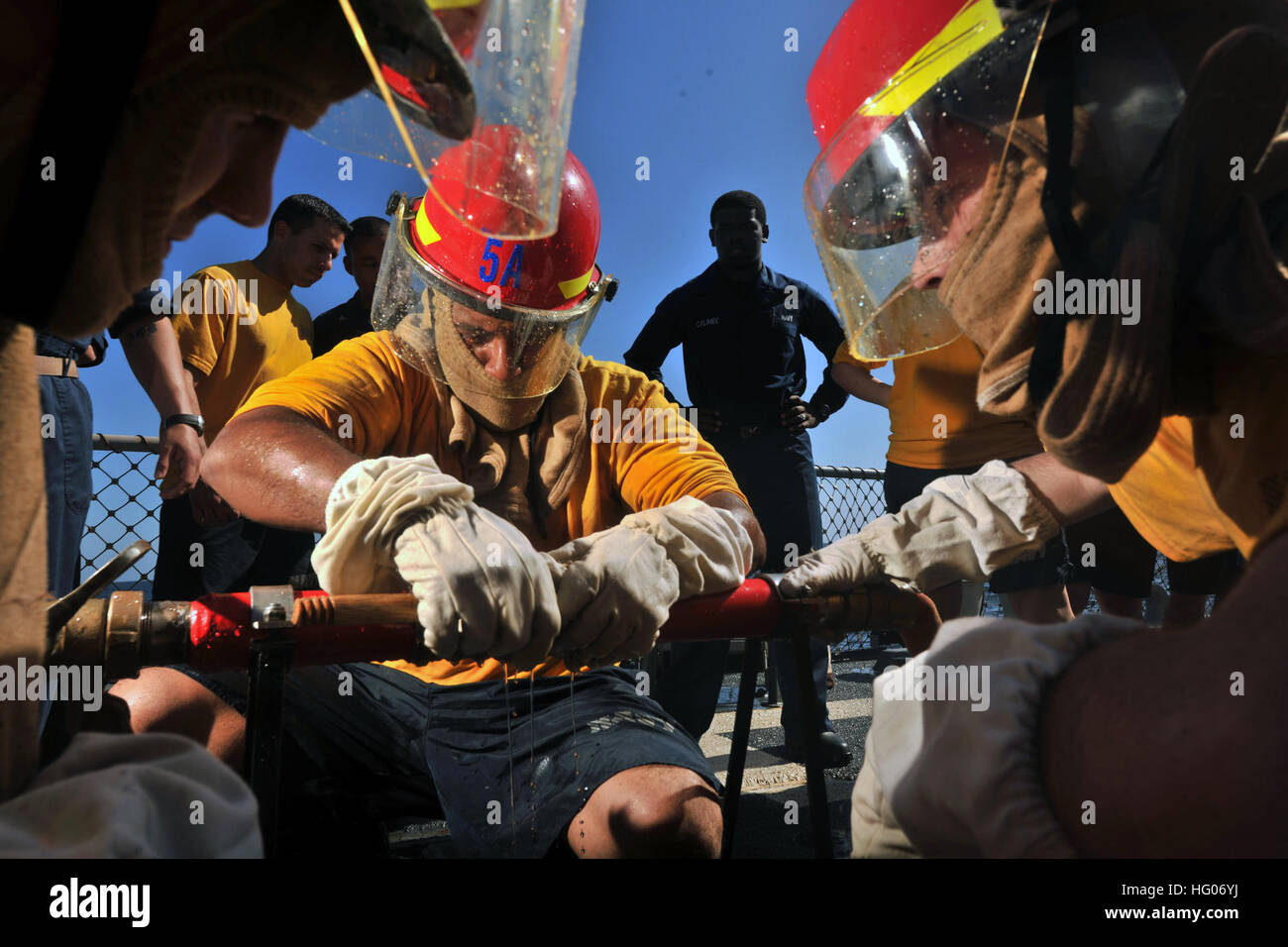Sailors perform damage control on USS Truxtun (DDG 103) during damage ...