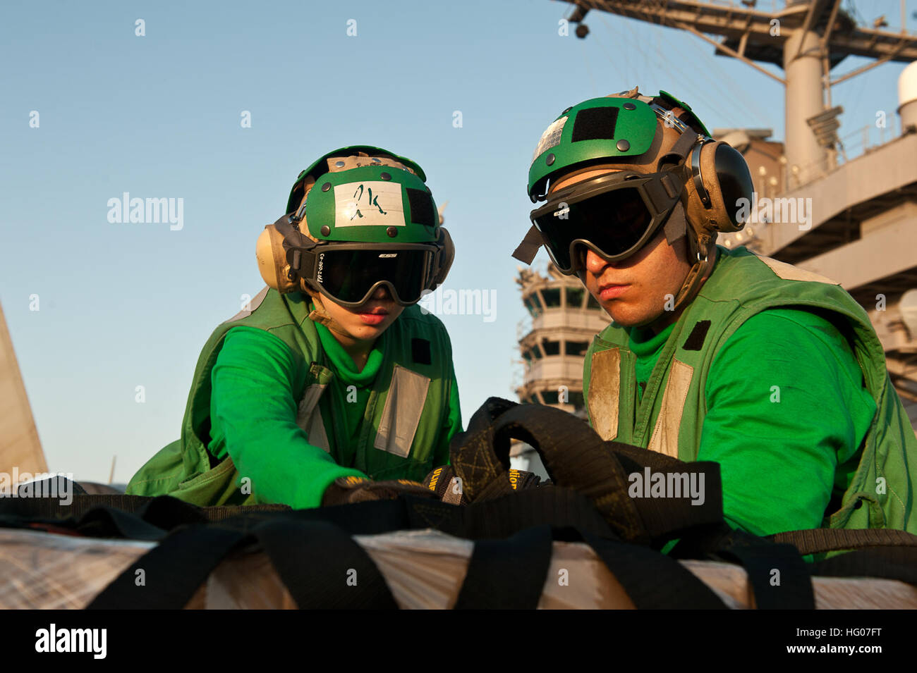 Logistics specialists perform vertical replenishment aboard USS John C ...