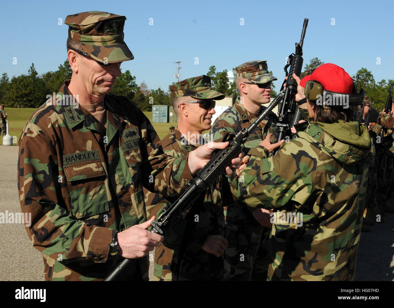 Personnel conduct weapons clearing procedures prior to an M16/M4 ...