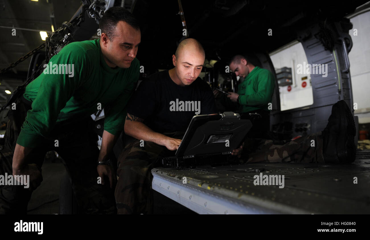 Aviation Structural Mechanics examine technical diagrams in the hangar ...