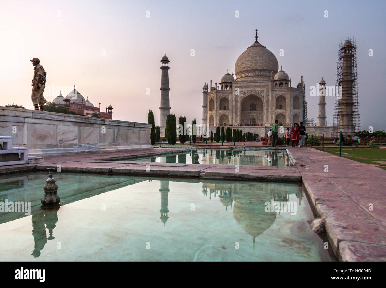 The reflex of Taj Mahal in the water in a hot summer afternoon. Agra ...