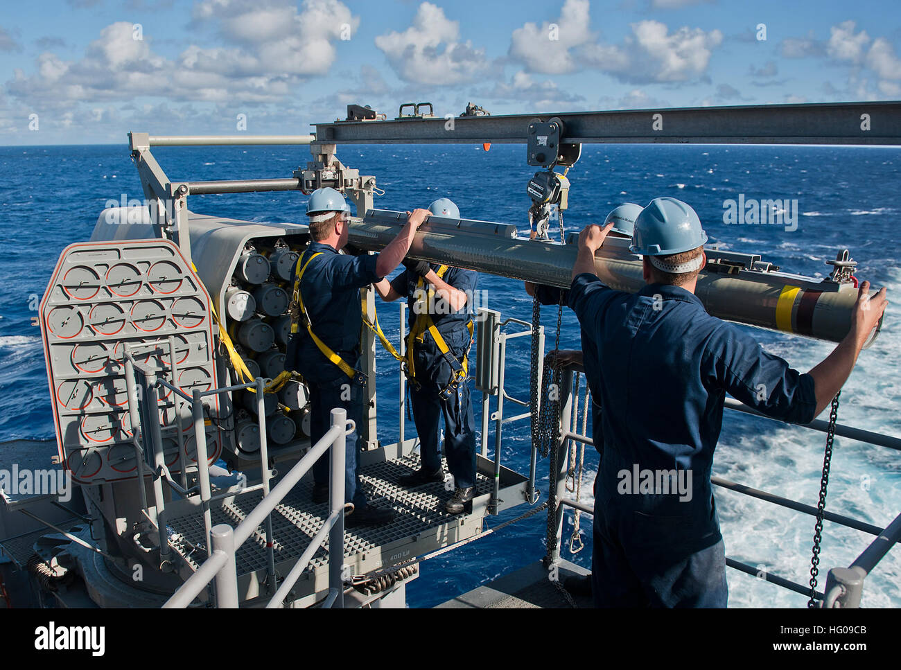 Fire controlmen load RIM-116 missiles into Mk 31 RAM launcher aboard ...