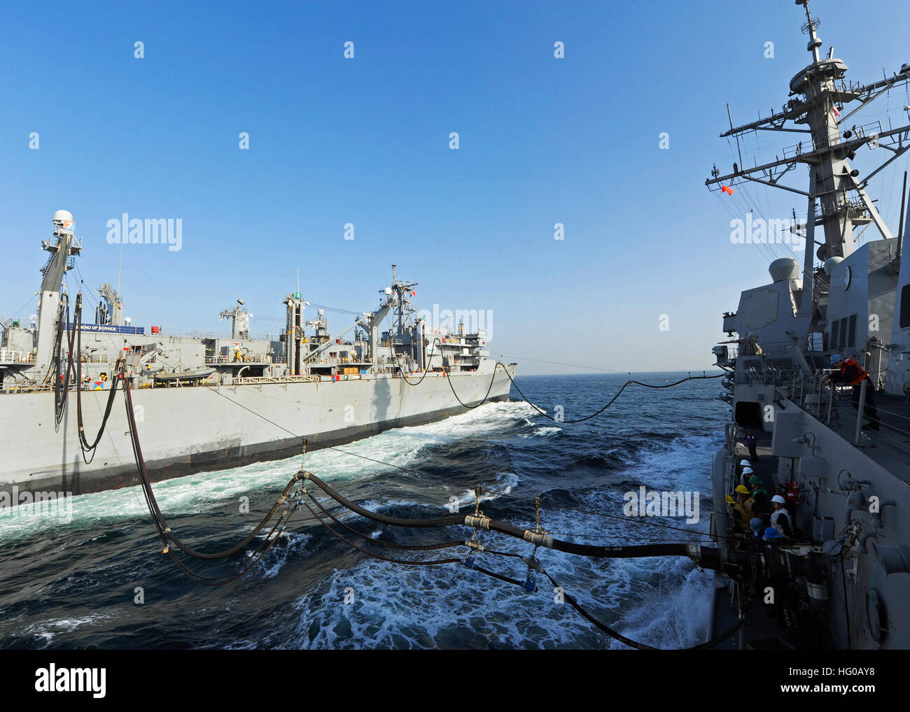 USNS Rainier (T-AOE 7) transits alongside Arleigh Burke-class guided ...