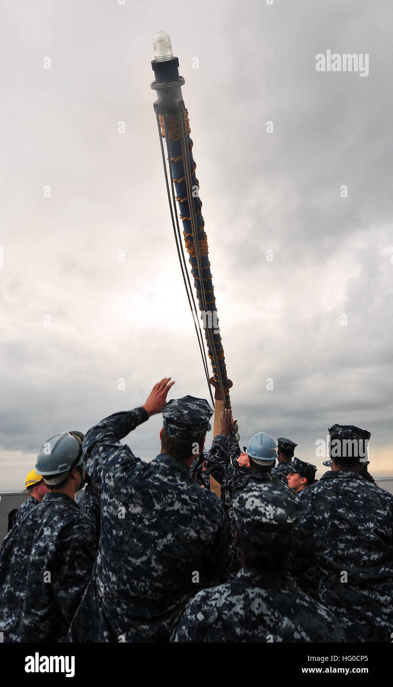 Sailors raise the forward mast aboard San Antonio class amphibious ...