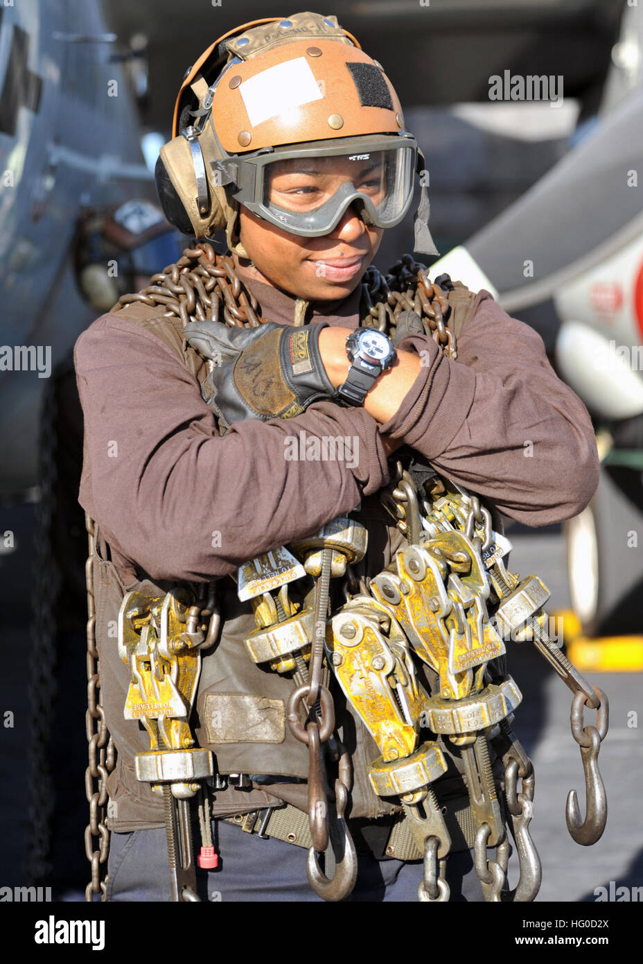 120120-N-YB753-016 ARABIAN SEA (Jan. 20, 2012) A plane captain carries ...