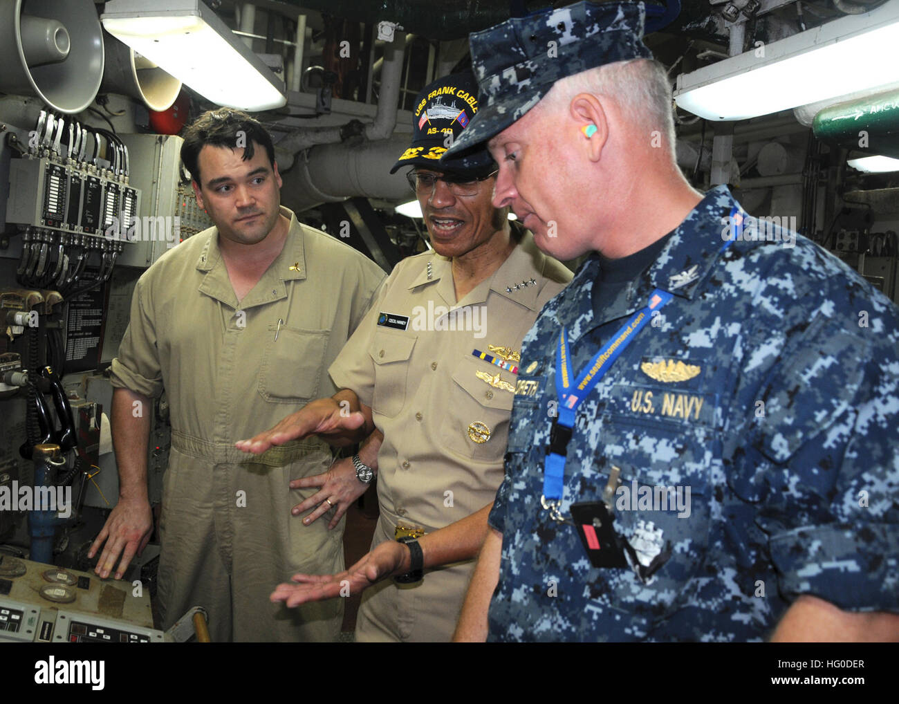 USS Frank Cable (AS 40), a submarine tender, is visited at Pearl Harbor ...