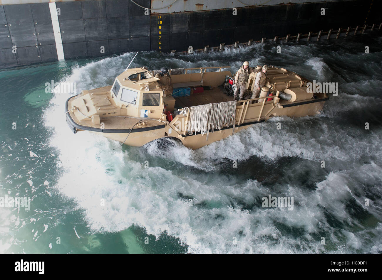 A lighter amphibious re-supply cargo departs the well deck of ...