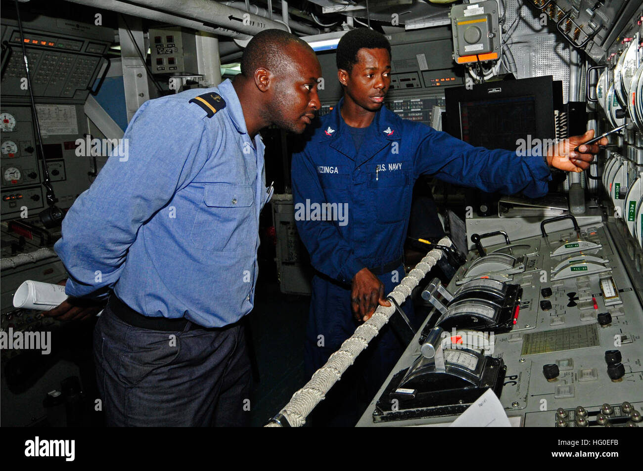 USS Simpson demonstrates propulsion control to a Gabonese officer as ...
