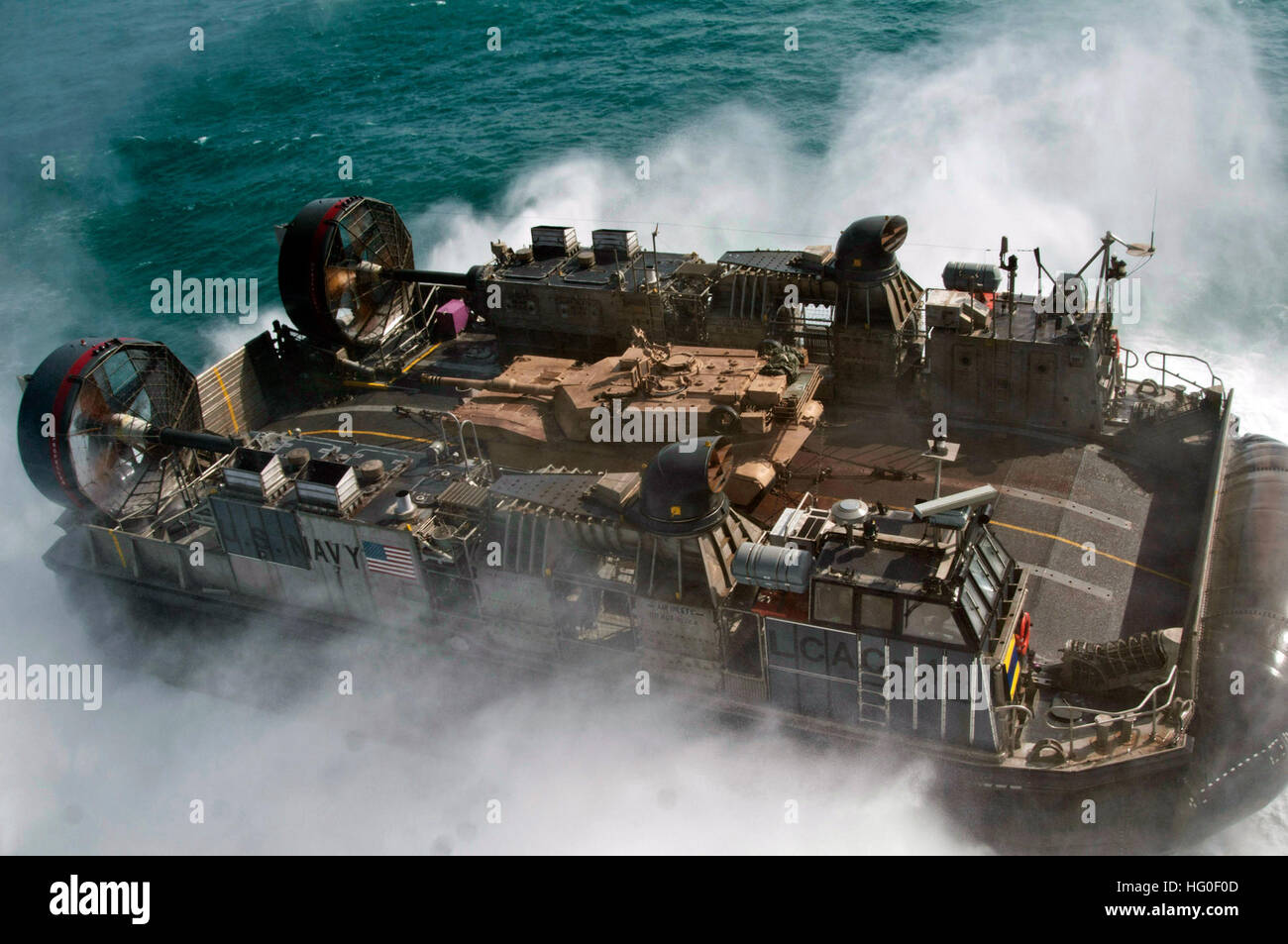A landing craft air cushion assigned to Assault Craft Unit 5 departs ...