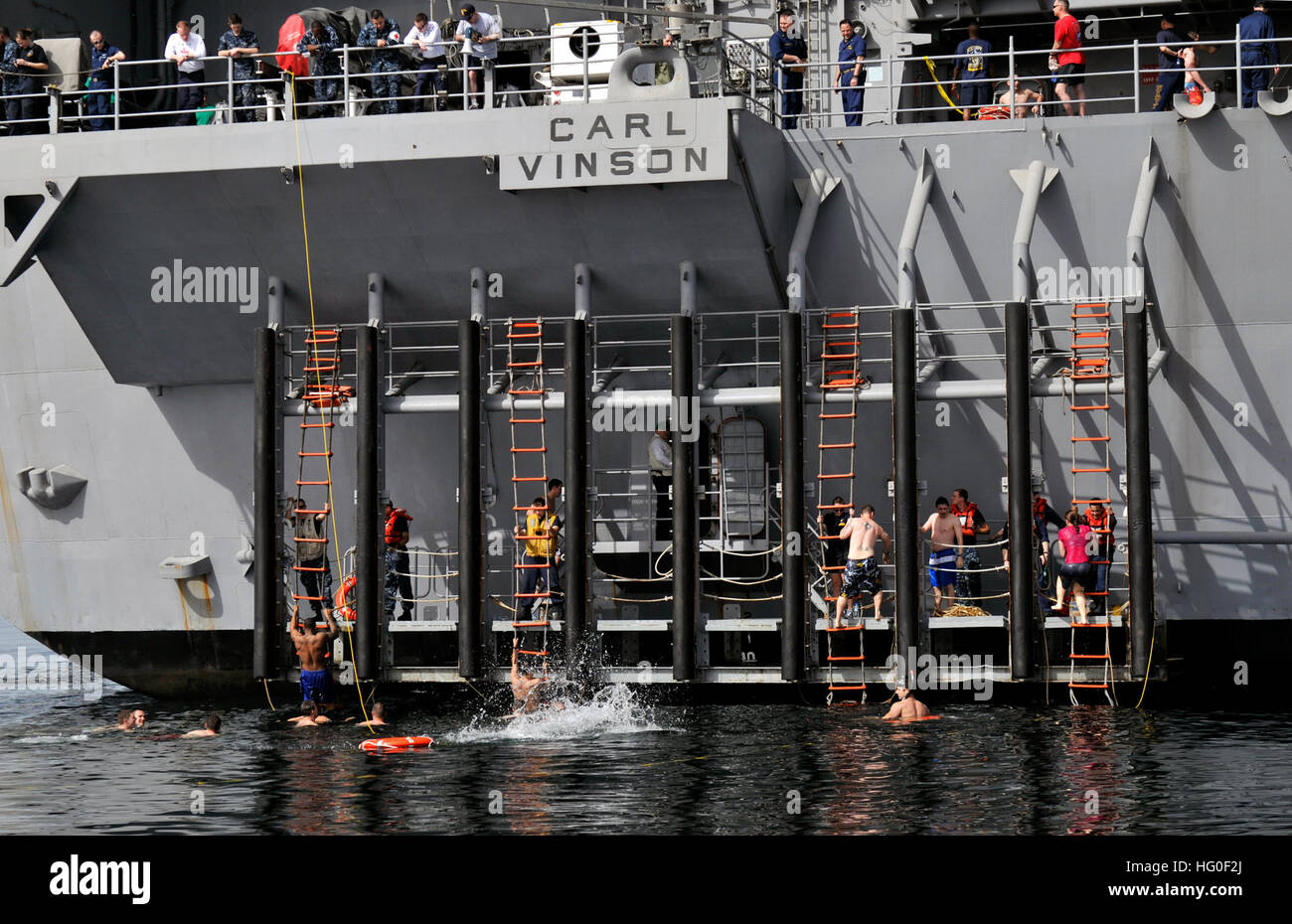 Sailors jump off aircraft elevator hi-res stock photography and images ...