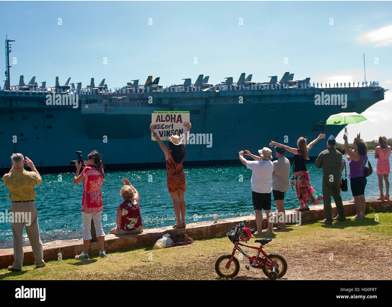 Family and friends of U.S. sailors stationed aboard aircraft carrier ...