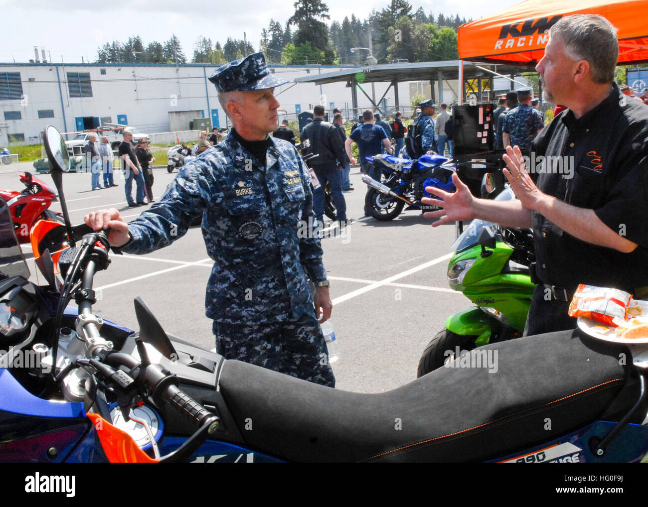 U.S. Navy Capt. Thom Burke, left, the aircraft carrier USS Ronald ...