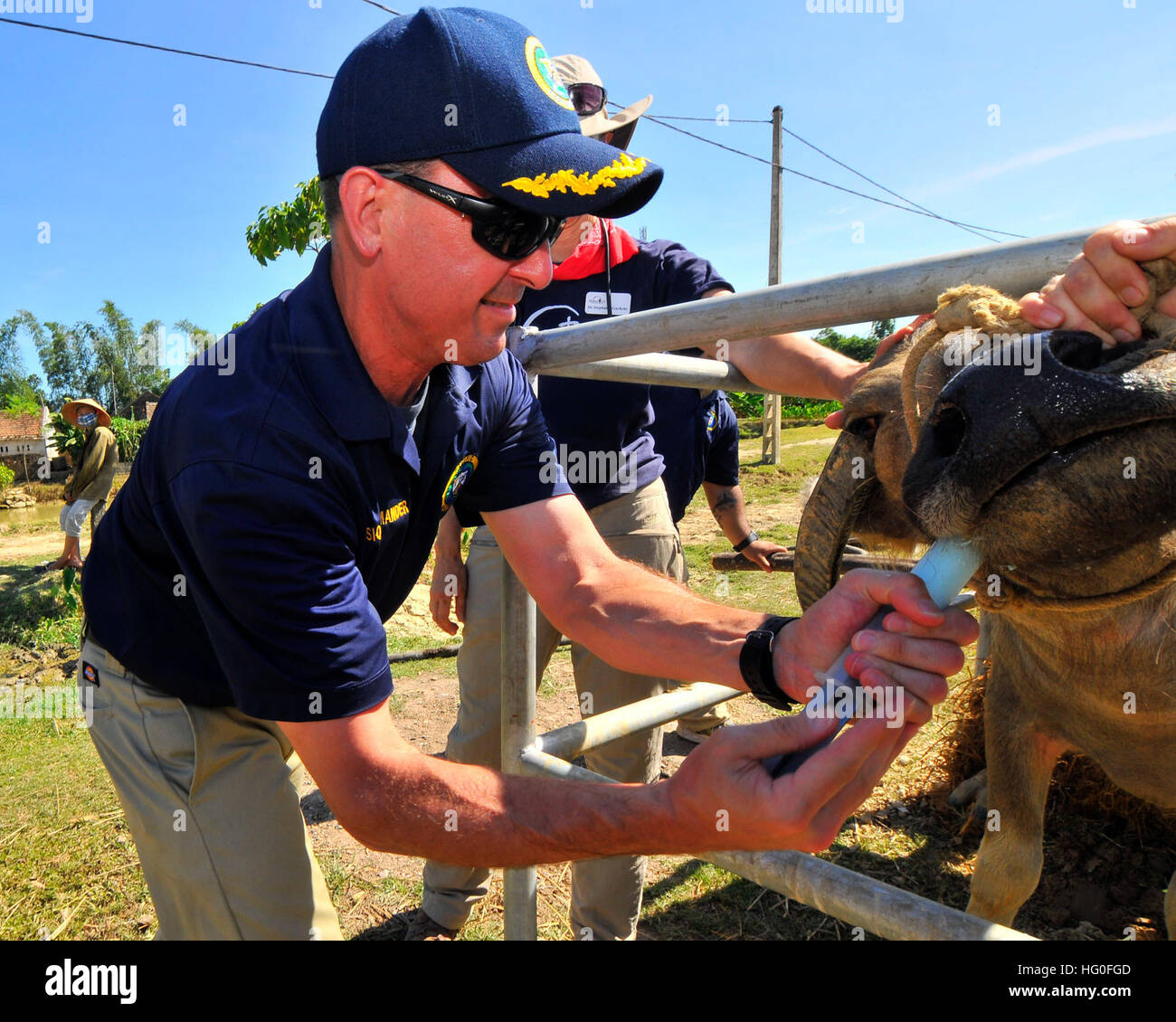 U.S. Navy Capt. James Morgan, left, the Pacific Partnership 2012 ...