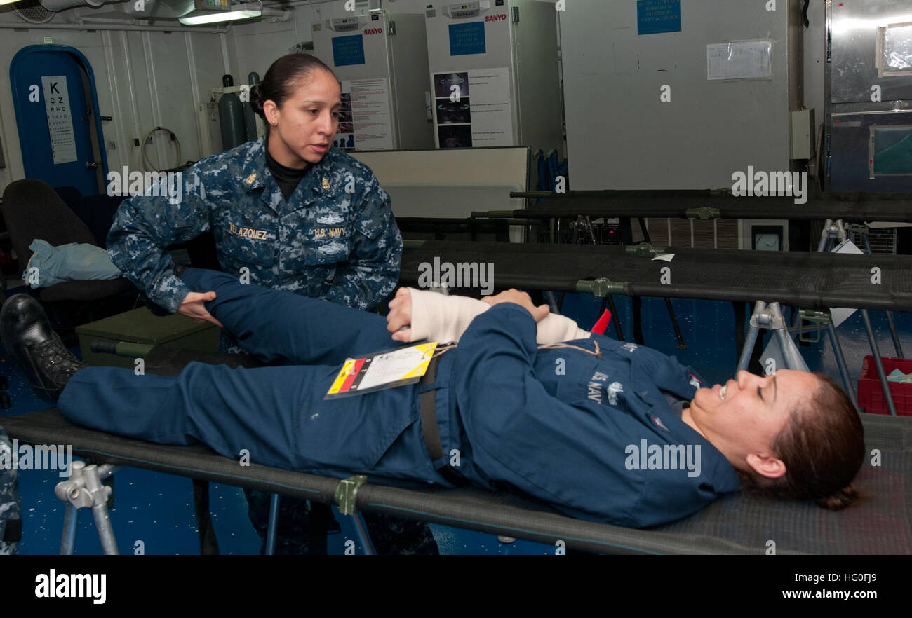 U.S. Navy Chief Hospital Corpsman Hazel Velazquez performs a medical ...