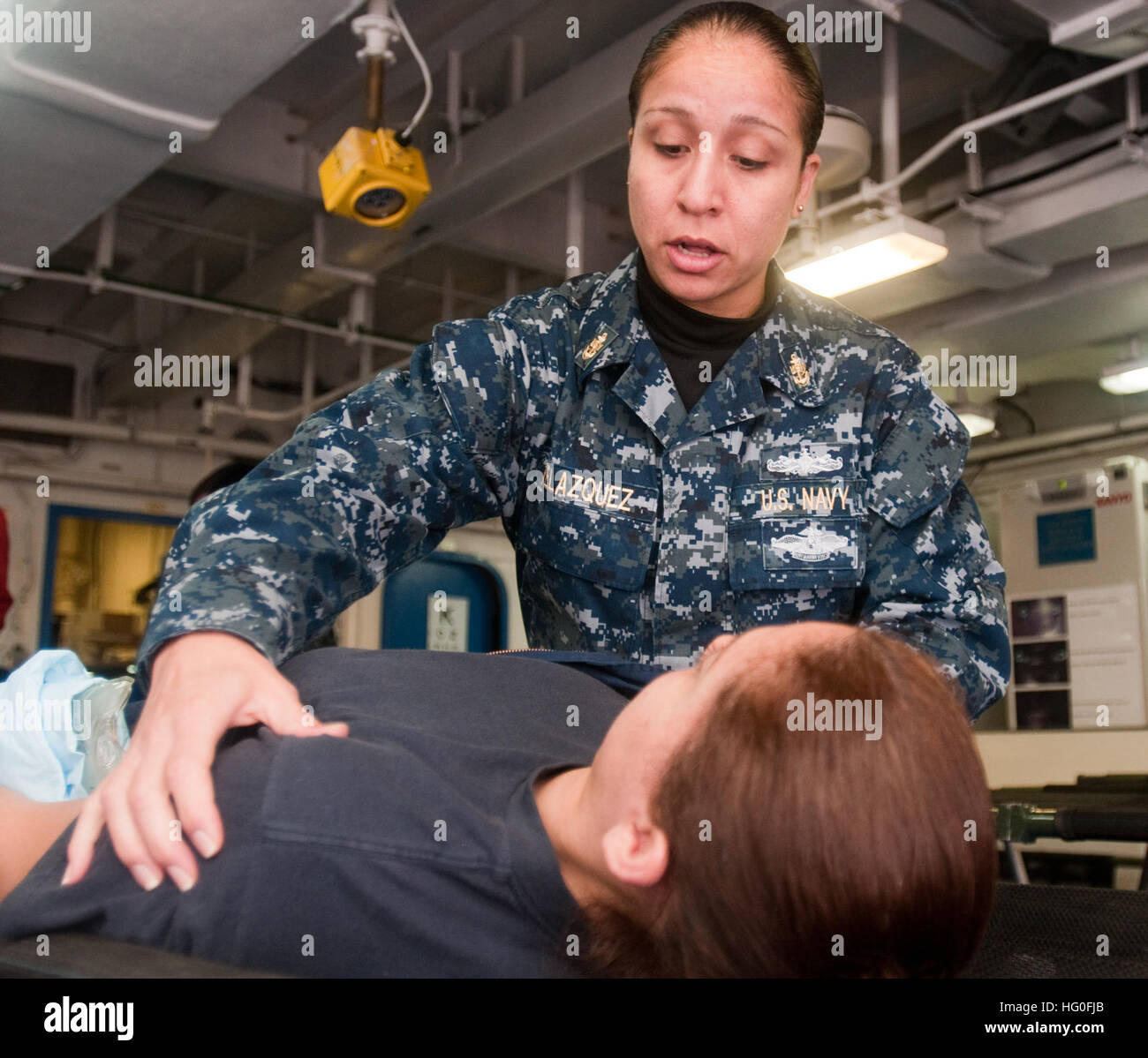 U.S. Navy Chief Hospital Corpsman Hazel Velazquez performs a medical ...