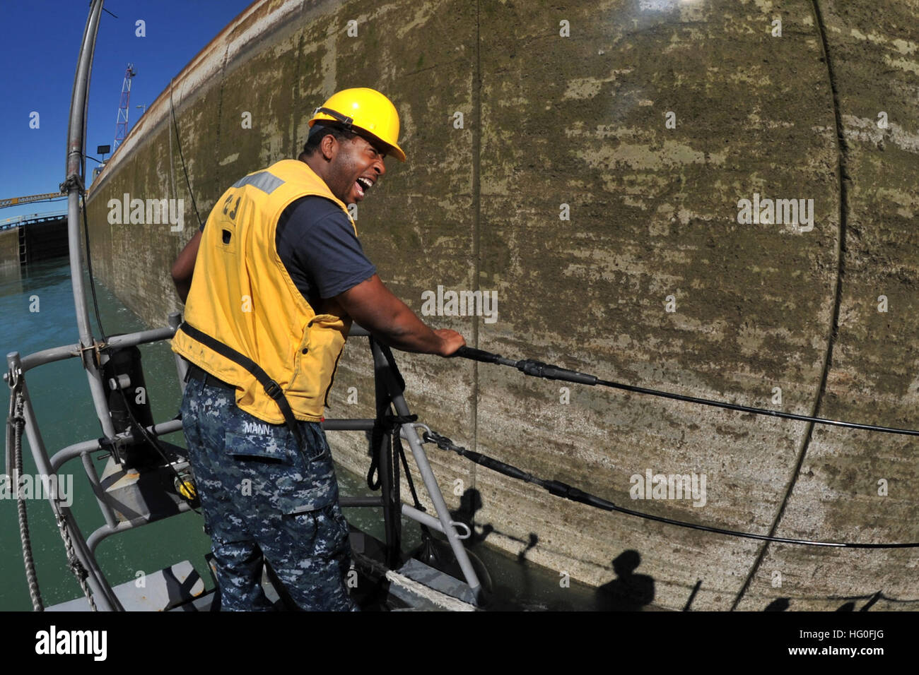 U.S. Navy Quartermaster 2nd Class Kamal Mann shouts instructions to ...