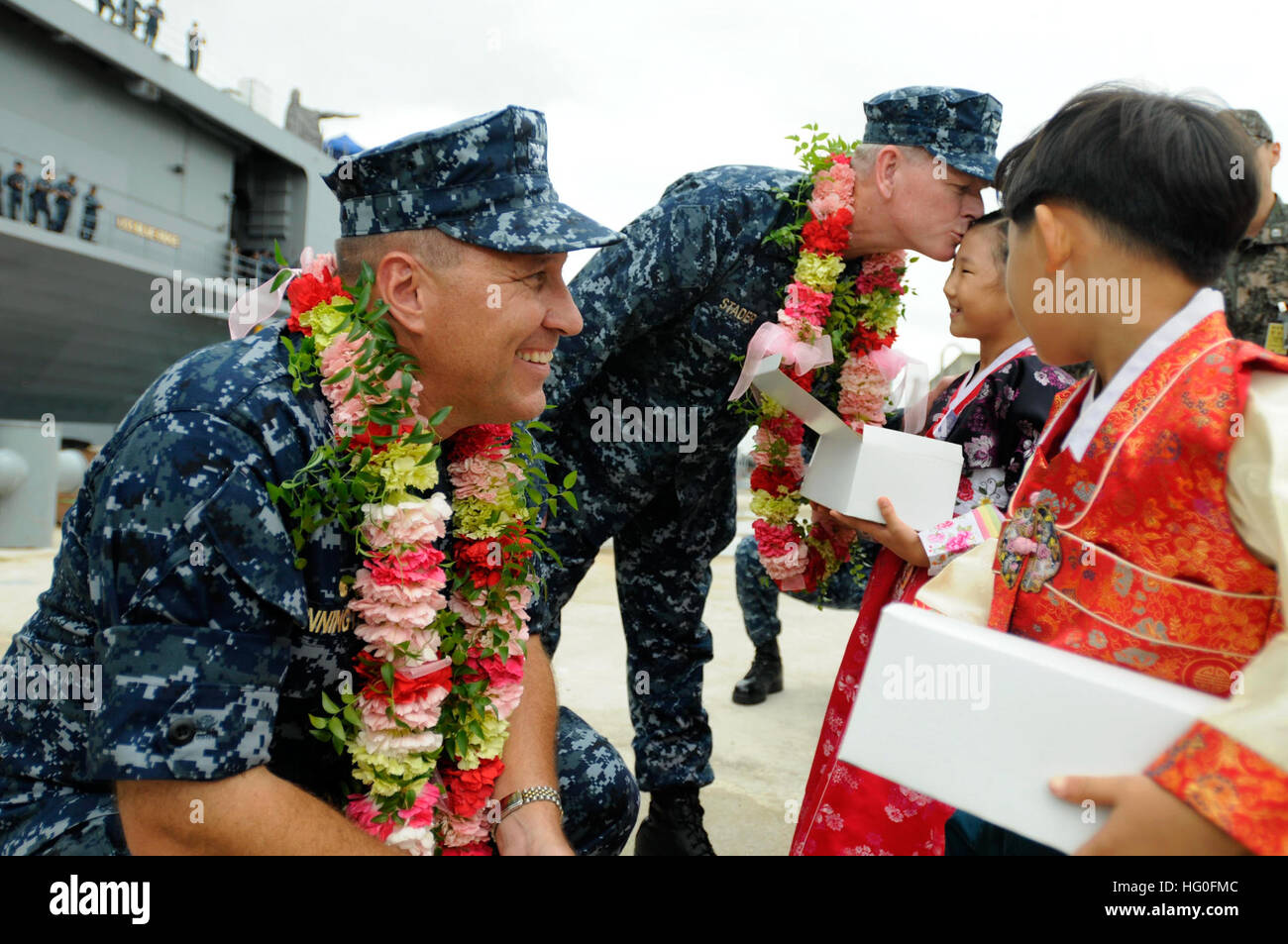U.S. 7th Fleet Chief of Staff Capt. Paul Stader, right, and USS Blue ...