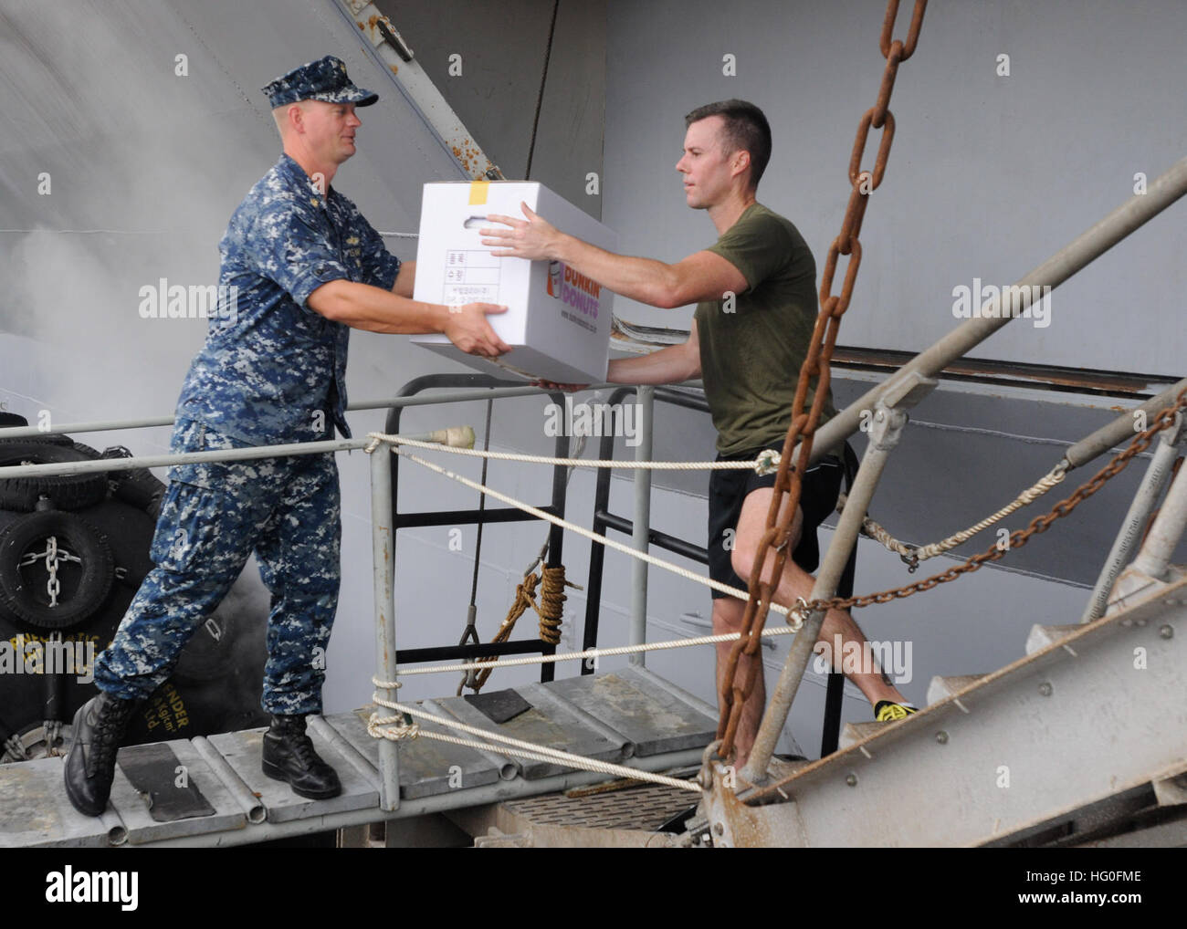Lt. Cmdr. Kevin Ralston, left, executive officer of U.S. 7th Fleet ...