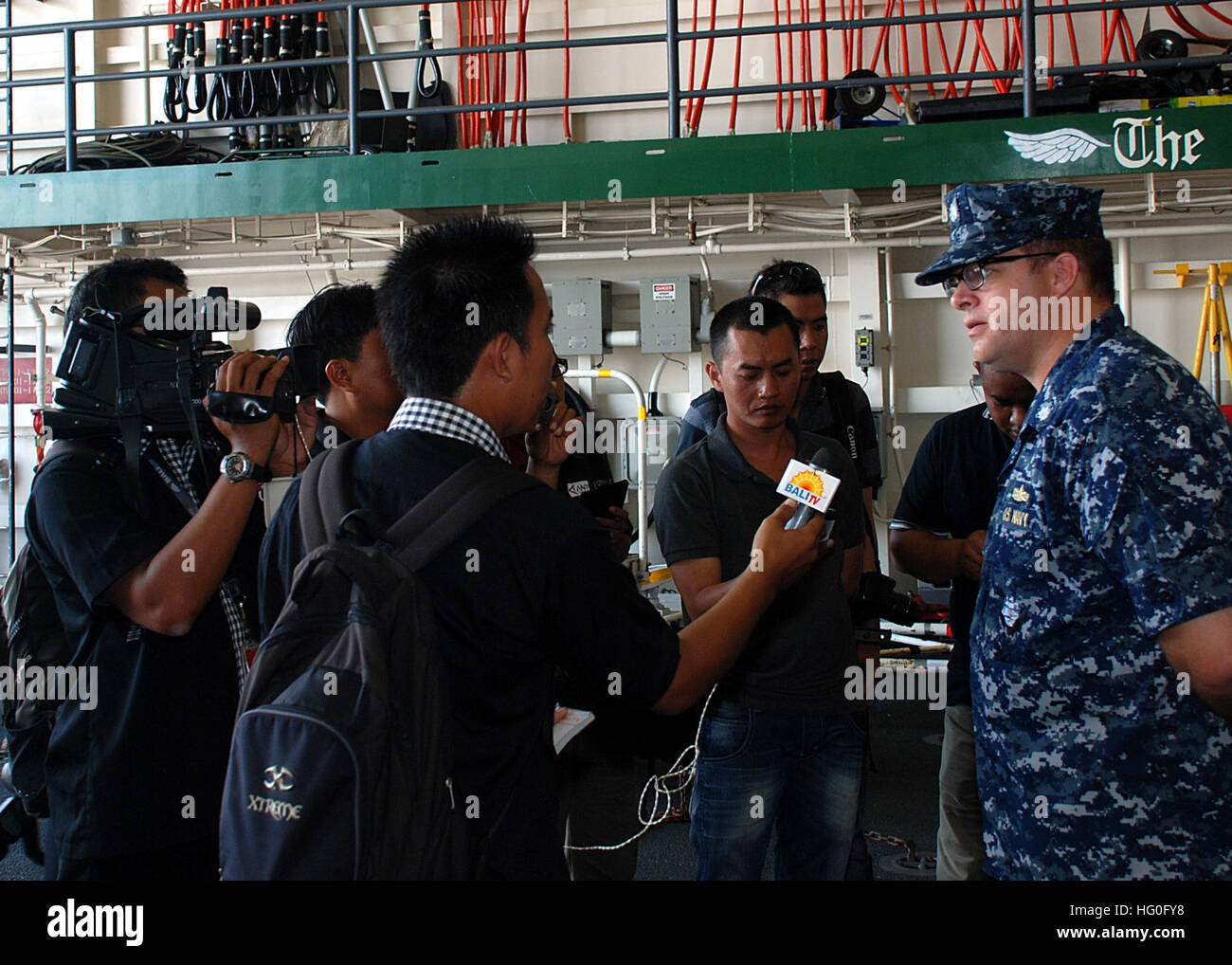 Executive Officer Cmdr. Tate Robinson gives an interview aboard ...