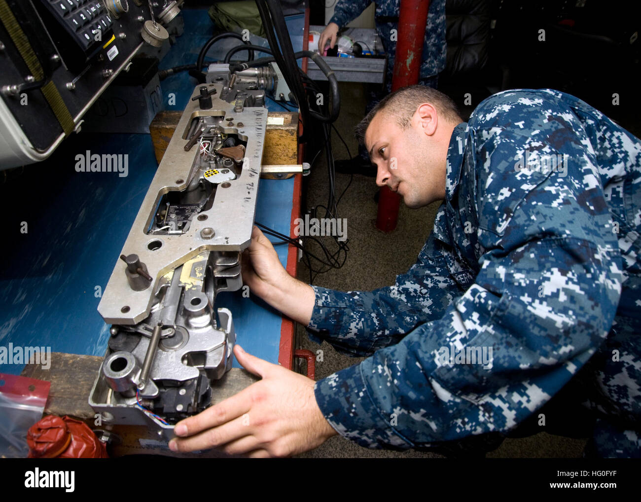 U.S. Navy Aviation Ordnanceman 3rd Class Jacob Walker performs ...