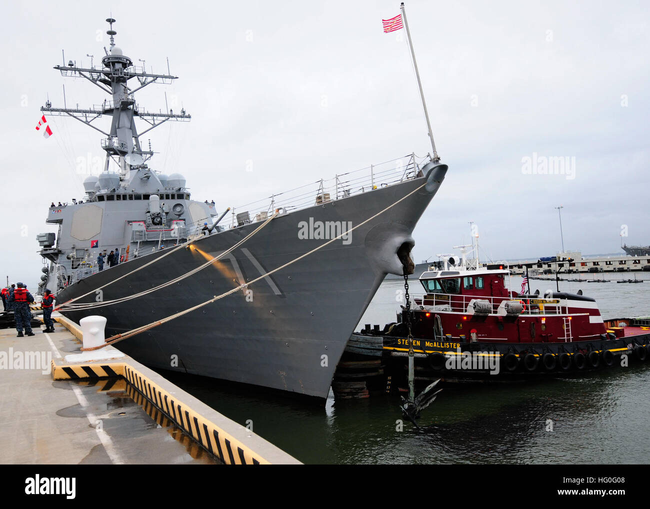 The guided-missile destroyer USS Ross (DDG 71) prepares to sortie in ...