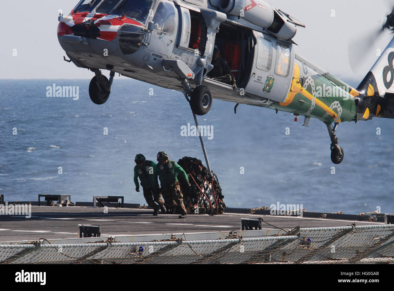 Sailors assigned to Military Sealift Command fast combat support ship USNS Bridge (T-AOE-10) run ...