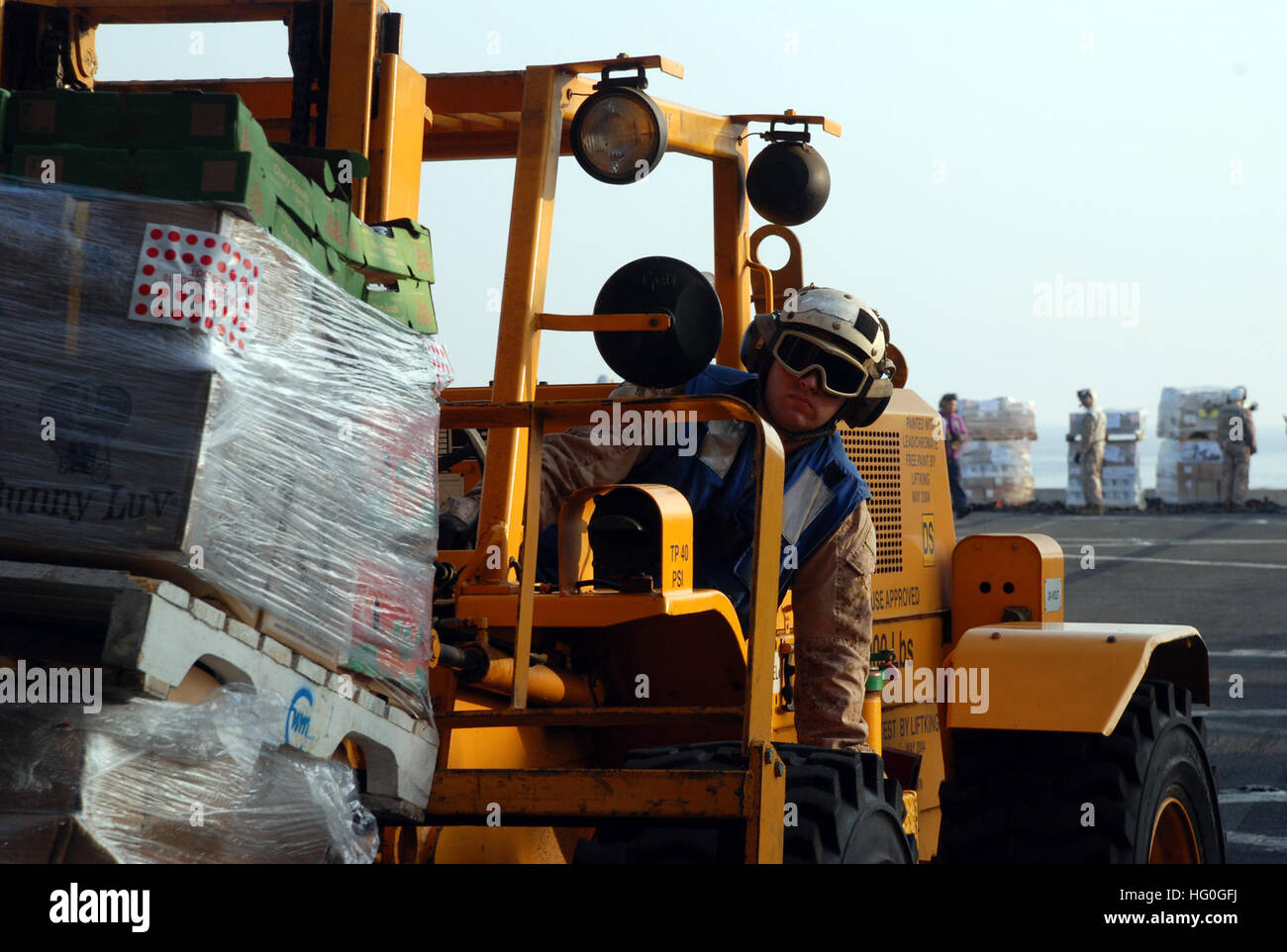 Lance Cpl. Matthew Kerstein moves cargo during a vertical replenishment ...