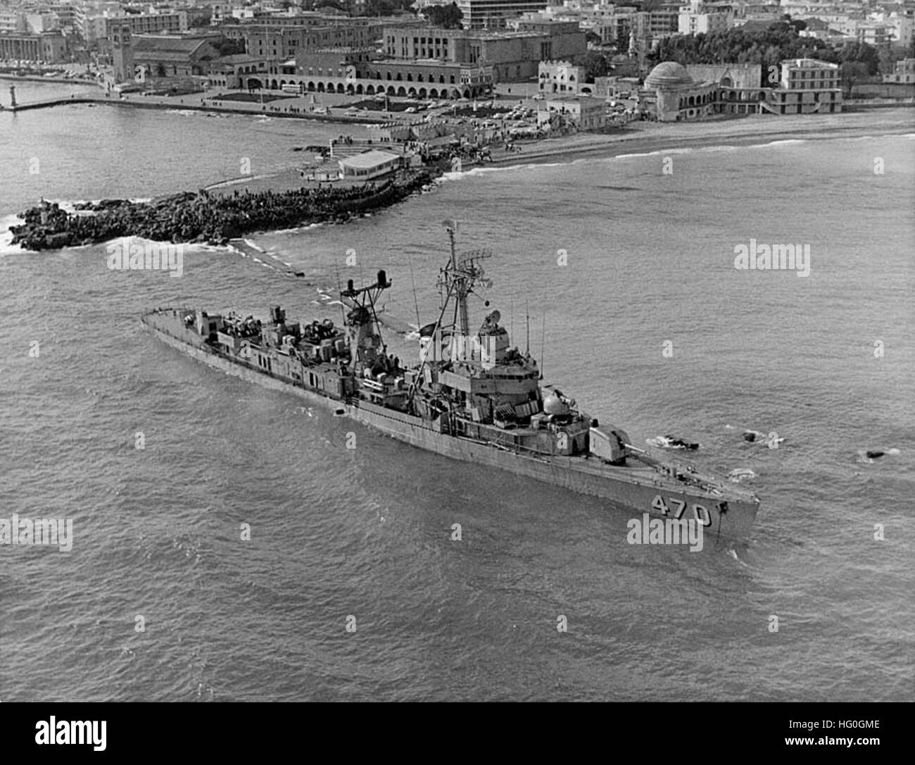 (DD-470) Aground just outside the harbor of Rhodes, Greece, circa February 1968. Note the many ...