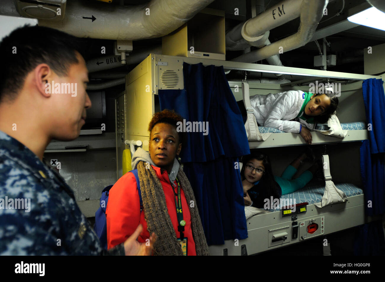 Sixth-grade students from Yokosuka Middle School listen to Ensign Andy ...