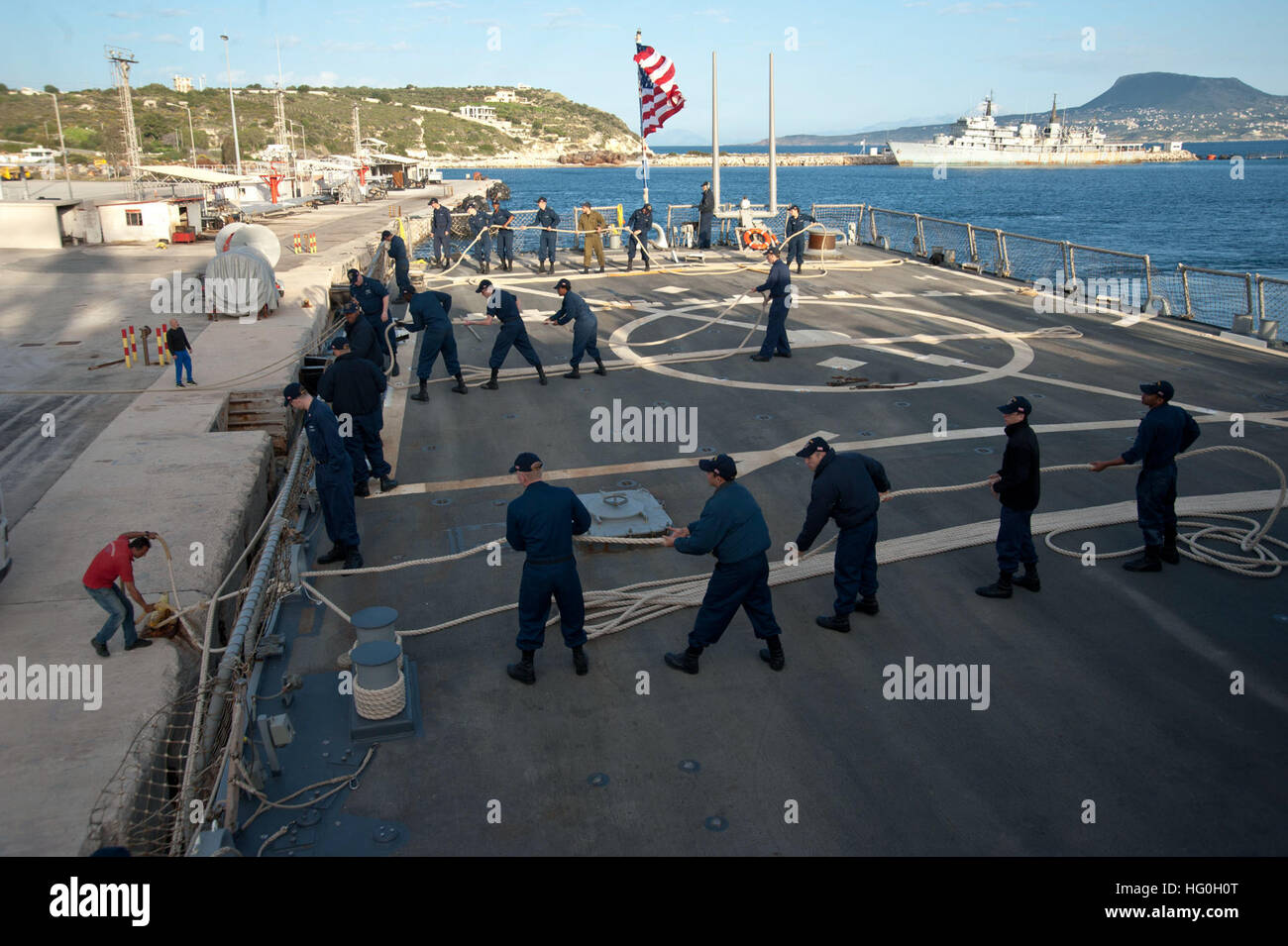 Sailors stationed aboard the guided-missile destroyer USS Barry (DDG 52 ...