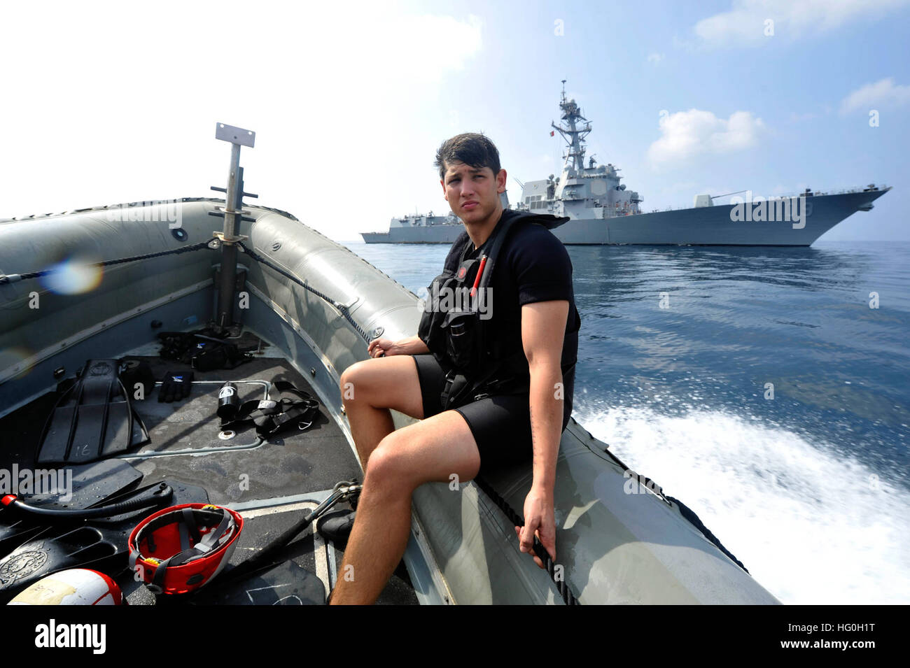 Naval Aircrewman 2nd Class Jeremiah Angerman rides in a rigid-hull ...