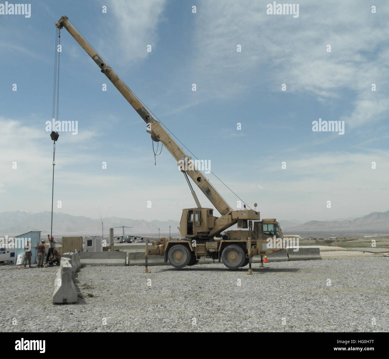 A crane operator assigned to Task Force Die Hard (857th HCC) operates a ...