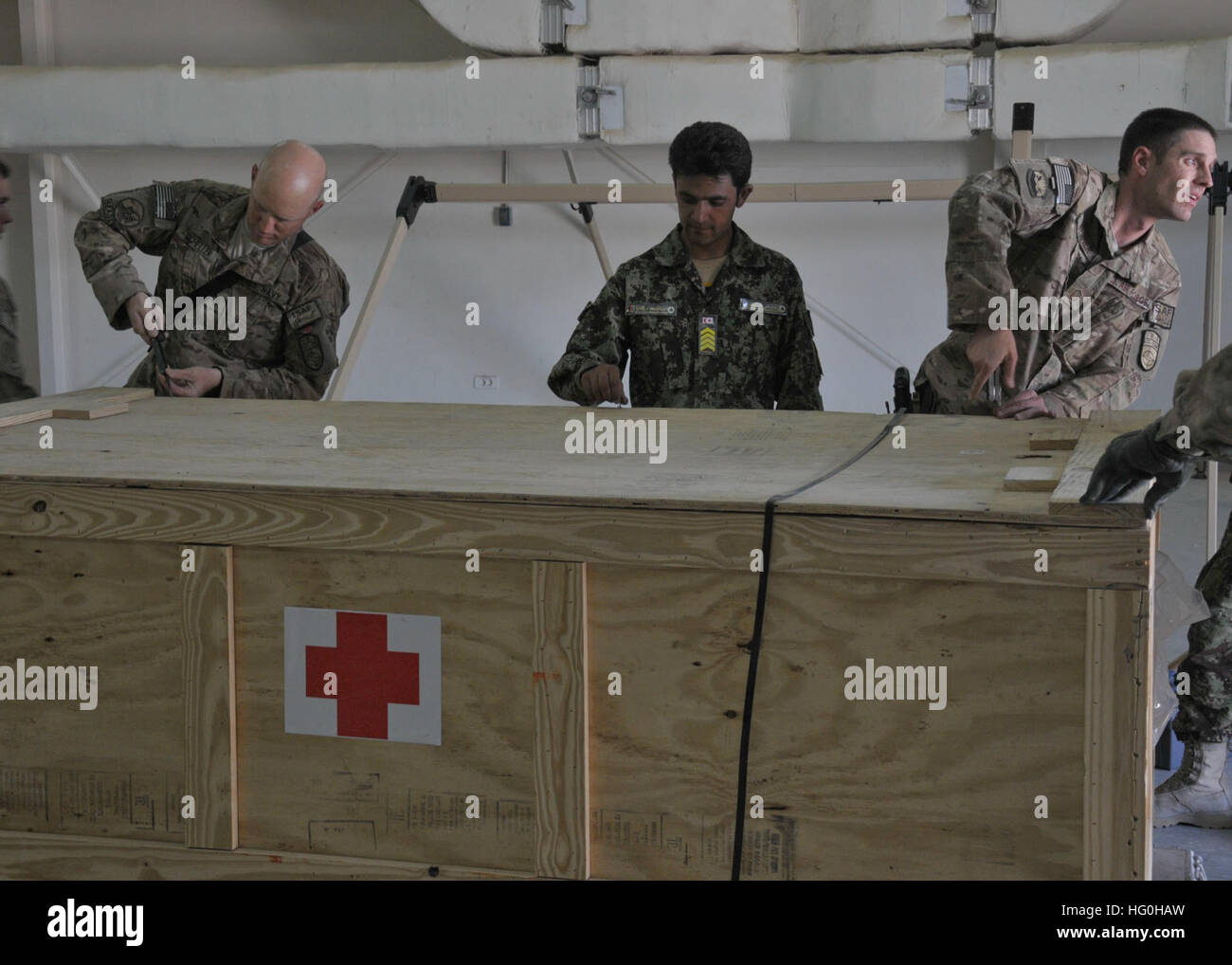 Coalition and Afghan service members work together setting up an air ...