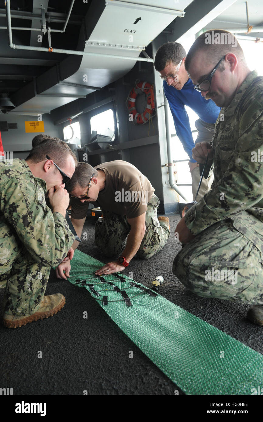 U.S. Sailors assigned to Explosive Ordnance Disposal Mobile Unit (EODMU ...