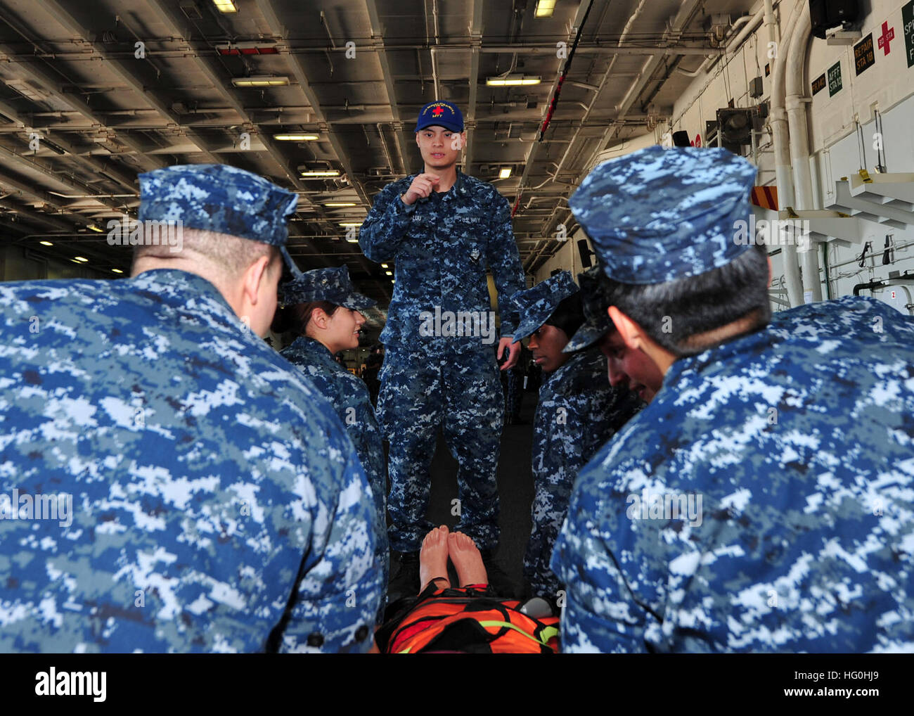Hospital Corpsman 2nd Class Morris Lulu, from Boston, instructs sailors ...