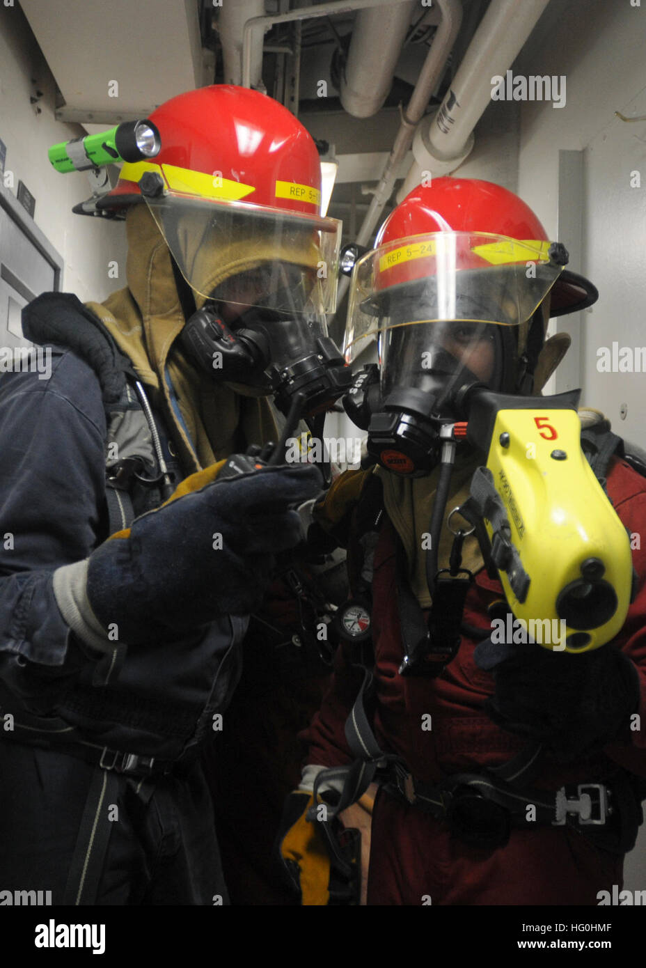 INDIAN OCEAN (June 22, 2013) Chief Hull Technician Joshua Ozburn, left ...