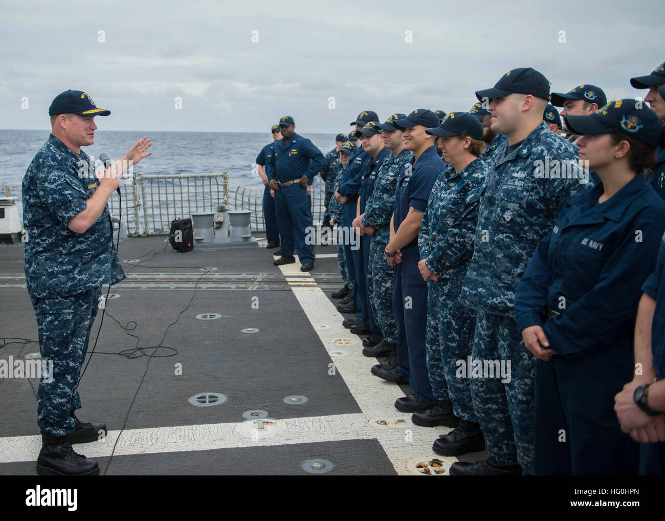 Rear Adm. Mark Montgomery, commander, Battle Force 7th Fleet, speaks to ...