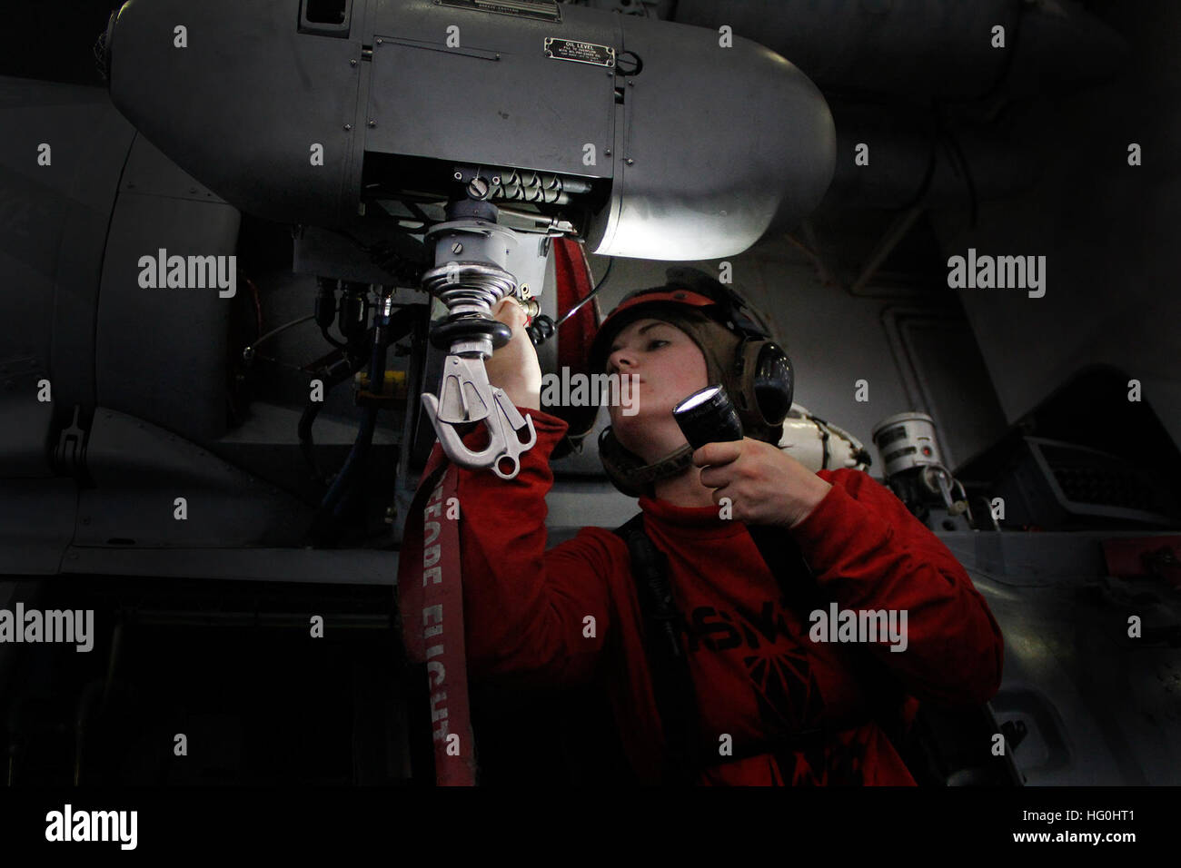 U.S. Navy Aviation Ordnanceman Airman Jessica Fulcher installs a ...