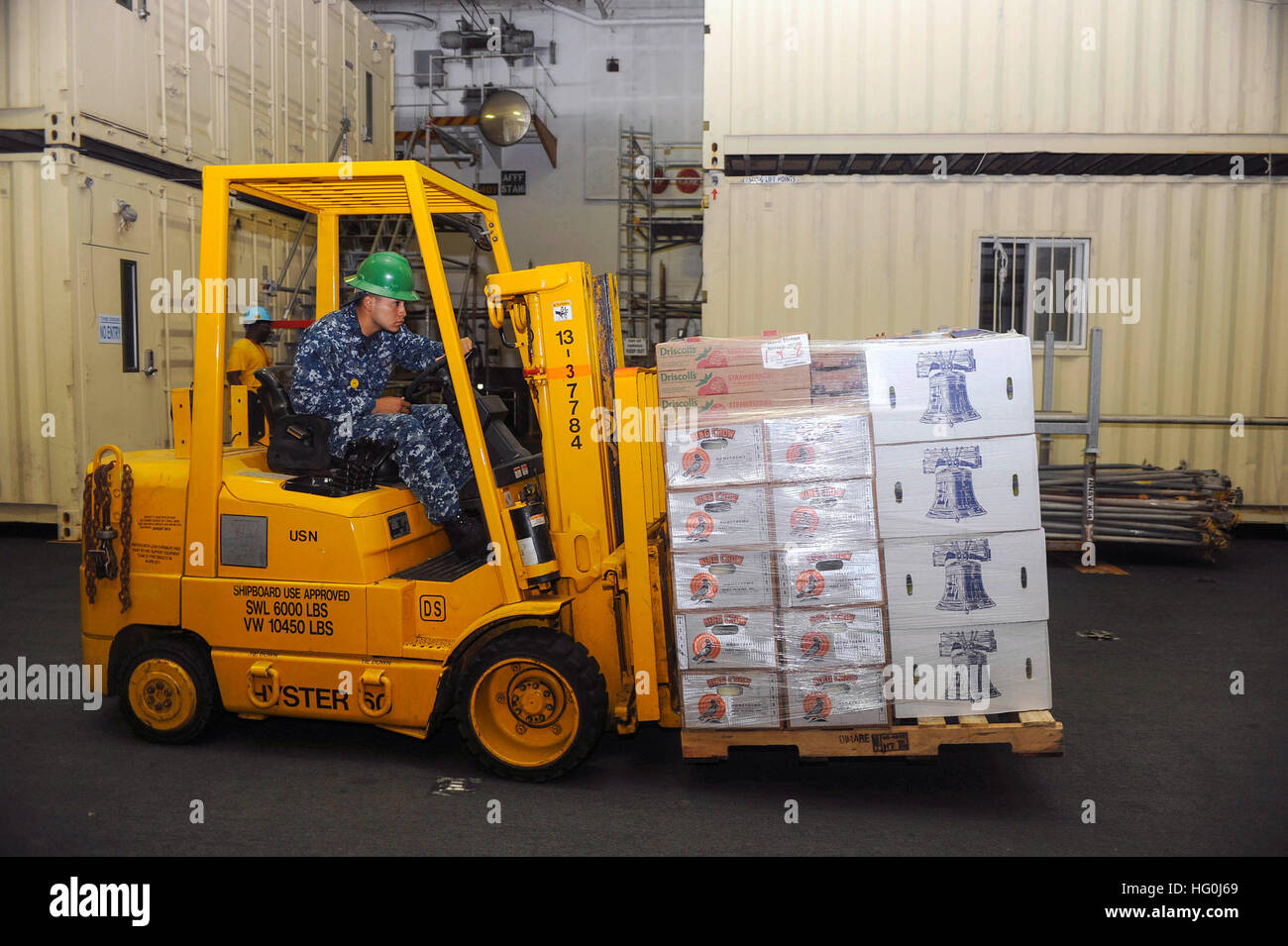 Logistics Specialist 3rd Class Esteban Cisneros, from Miami, transports ...