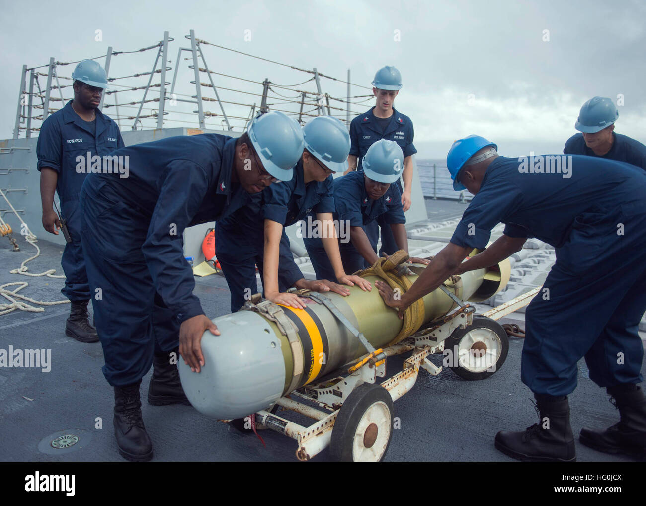 Sailors transport an MK 46 torpedo during a transfer evolution aboard ...