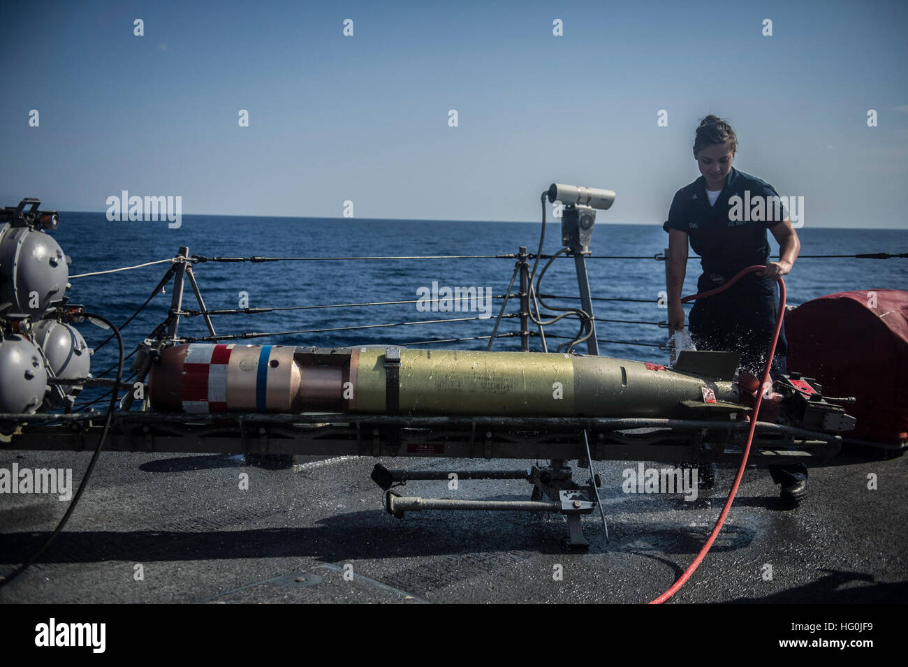 Gunner's Mate 3rd Class Amelia Sandoval performs maintenance on a test ...