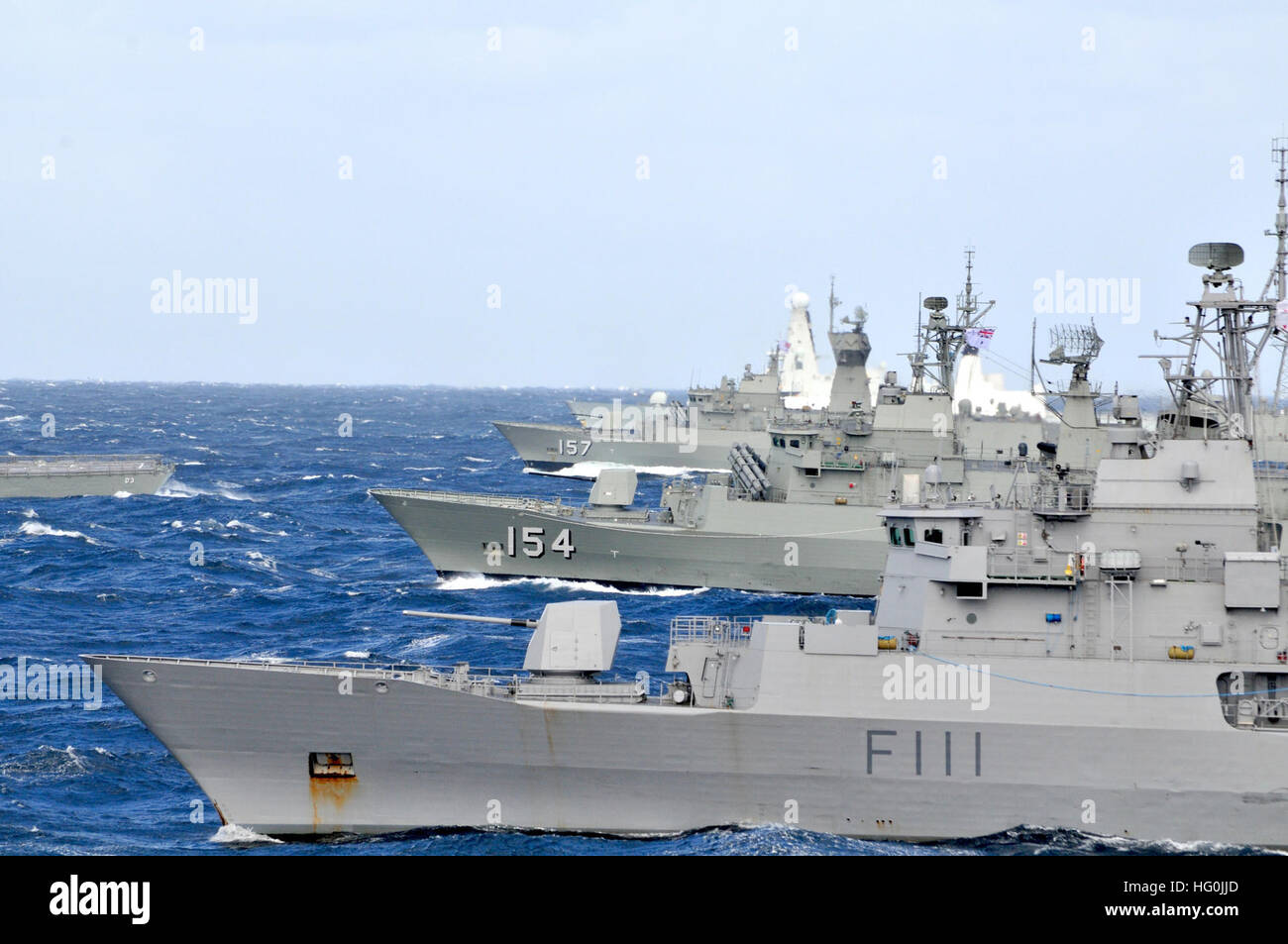 The guided-missile Cruiser USS Chosin (CG 65) joins ships for a photo ...